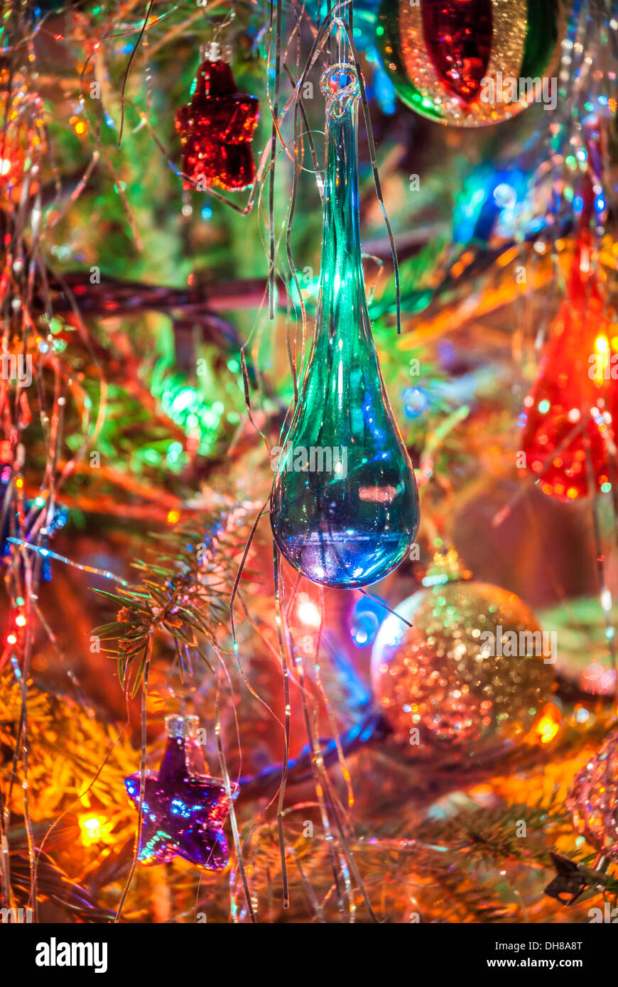 Christmas tree decorations with baubles, fairy lights and tinsel Stock ...