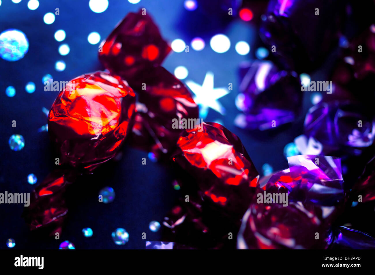 Red and blue wrapped sweets Stock Photo - Alamy