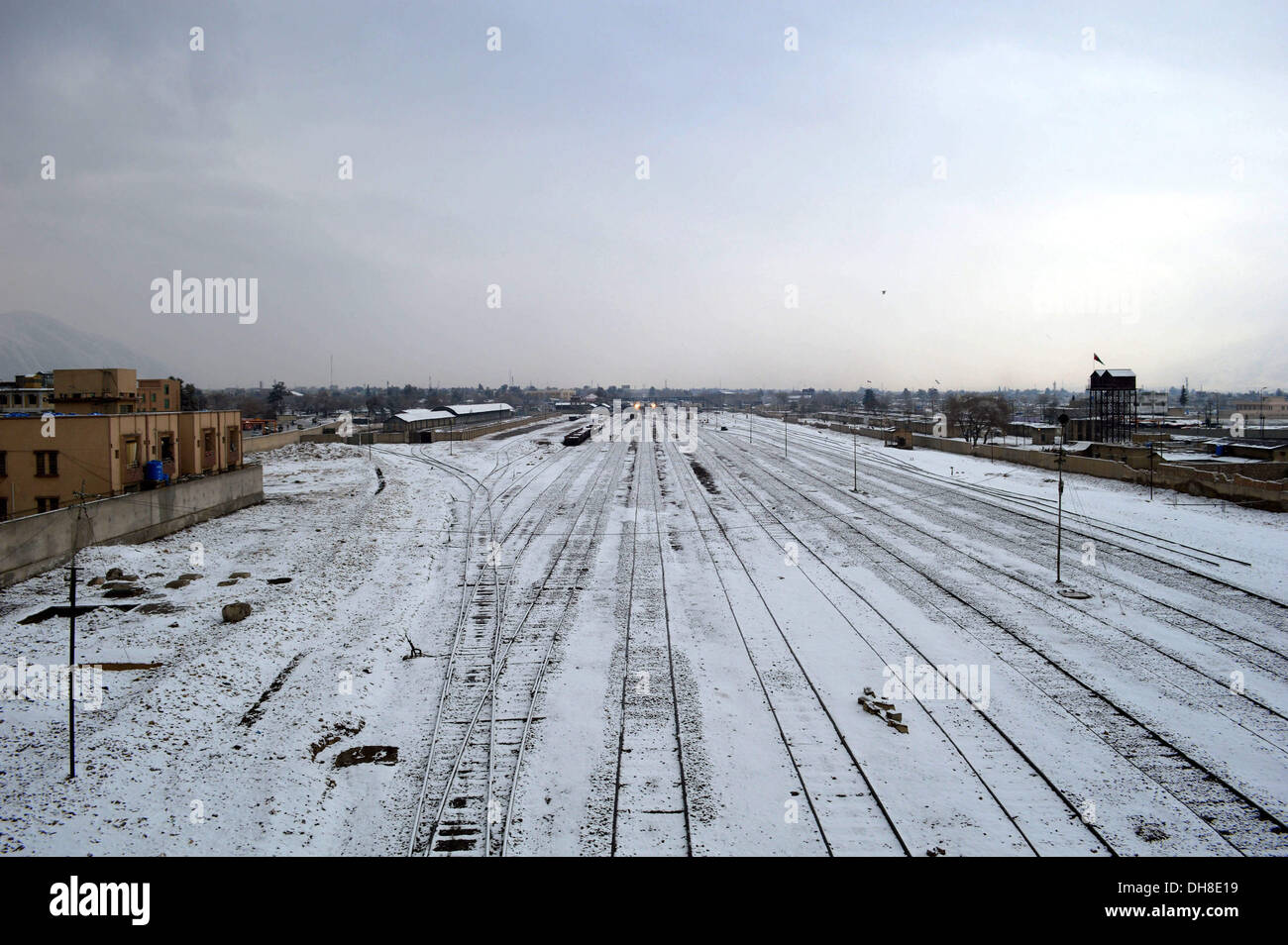Quetta. 8th Jan, 2014. Snow-covered railway tracks are seen at a ...
