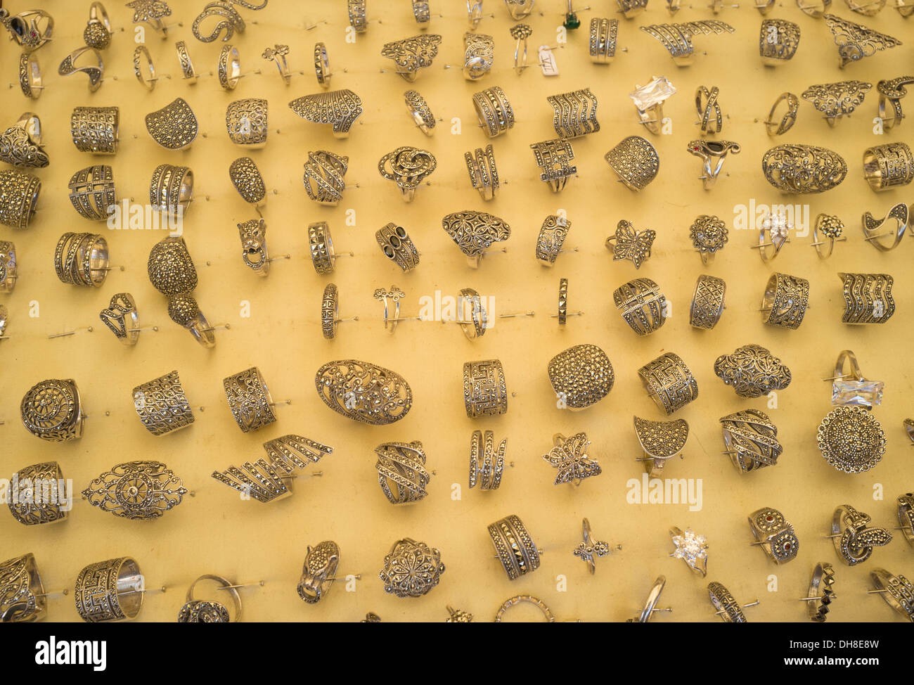 Silver trinkets displayed on a market stall Stock Photo - Alamy