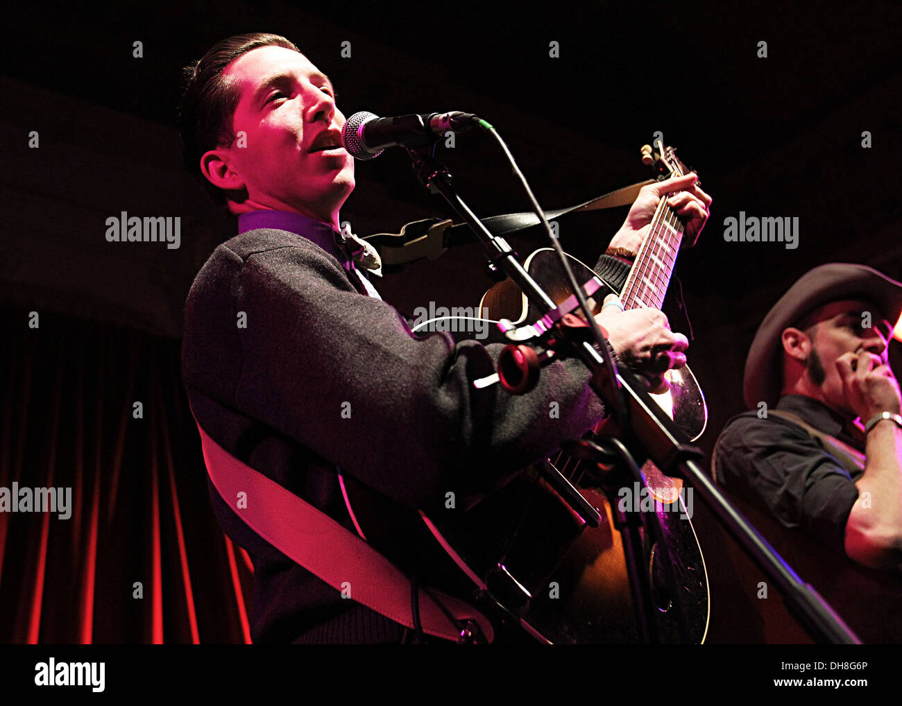 Pokey LaFarge of Pokey LaFarge and South City Three performing on stage ...