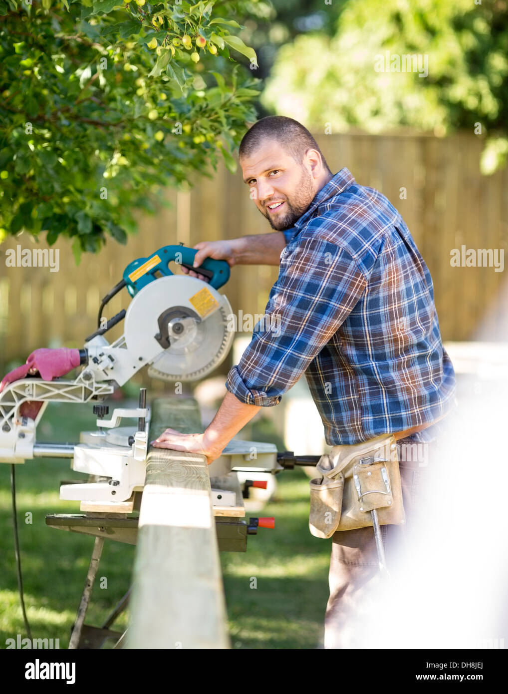 Manual Worker Cutting Wood Using Table Saw At Site Stock Photo - Alamy