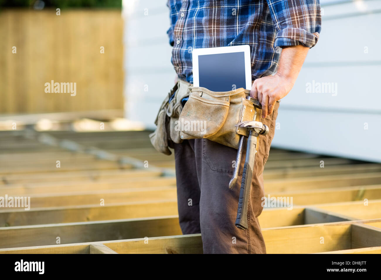 Construction Worker With Tablet Computer And Hammer In Toolbelt Stock ...