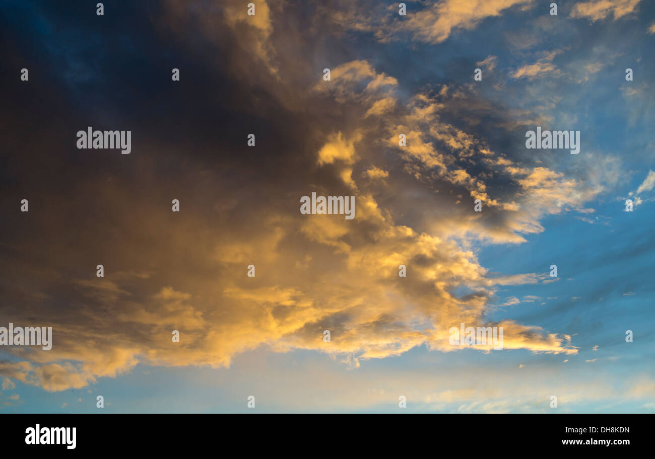 Sunset through the clouds Stock Photo - Alamy