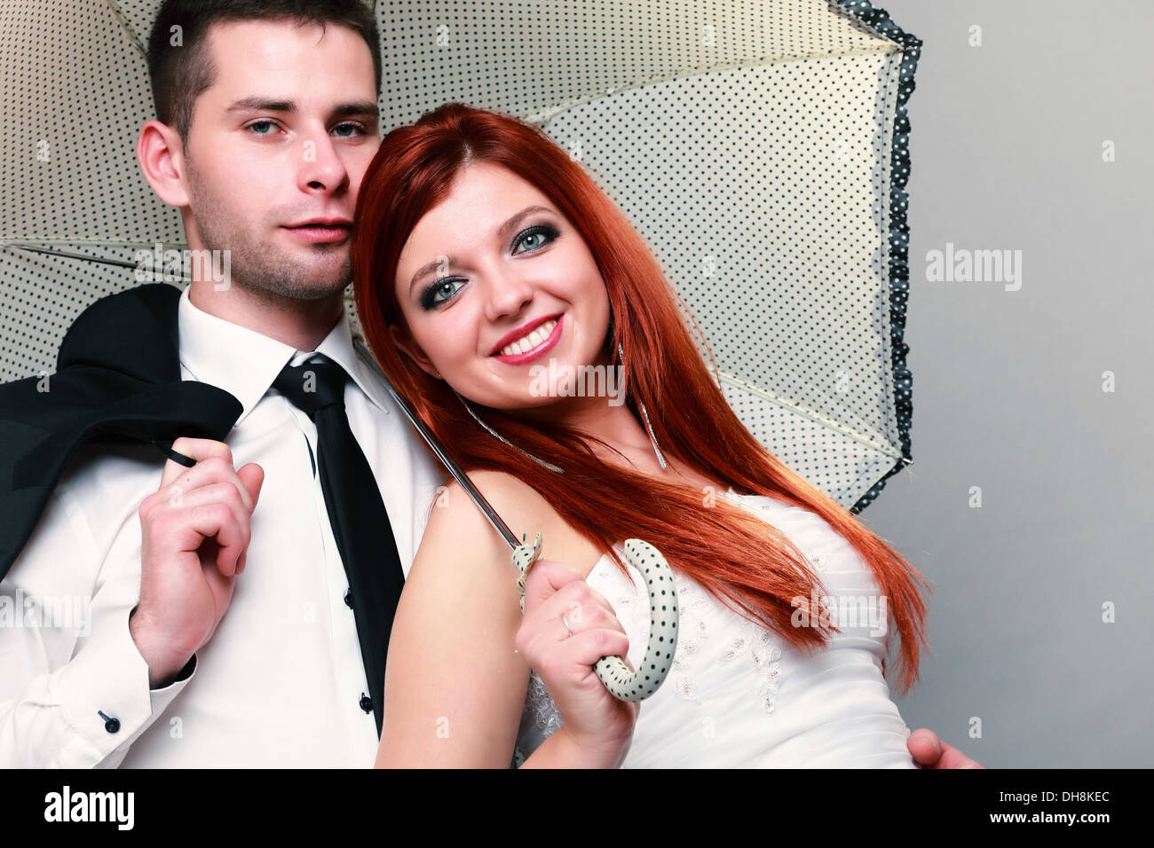 Wedding day. Portrait of happy married couple red haired blue eyed ...