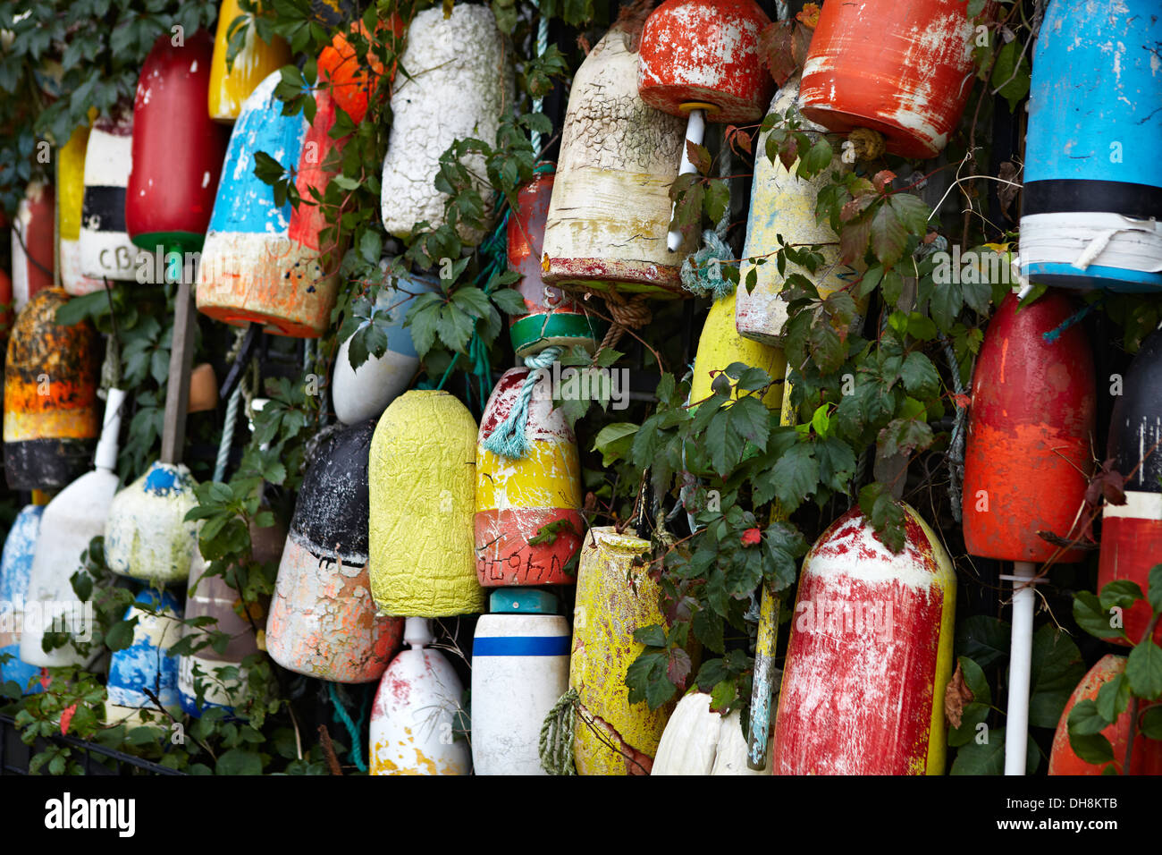 Old Bouys hanging on fence Stock Photo - Alamy