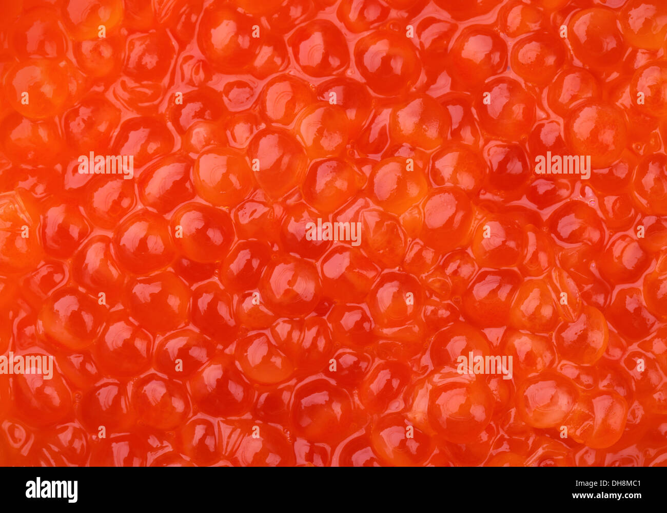 Salted red caviar macro photo background texture Stock Photo - Alamy