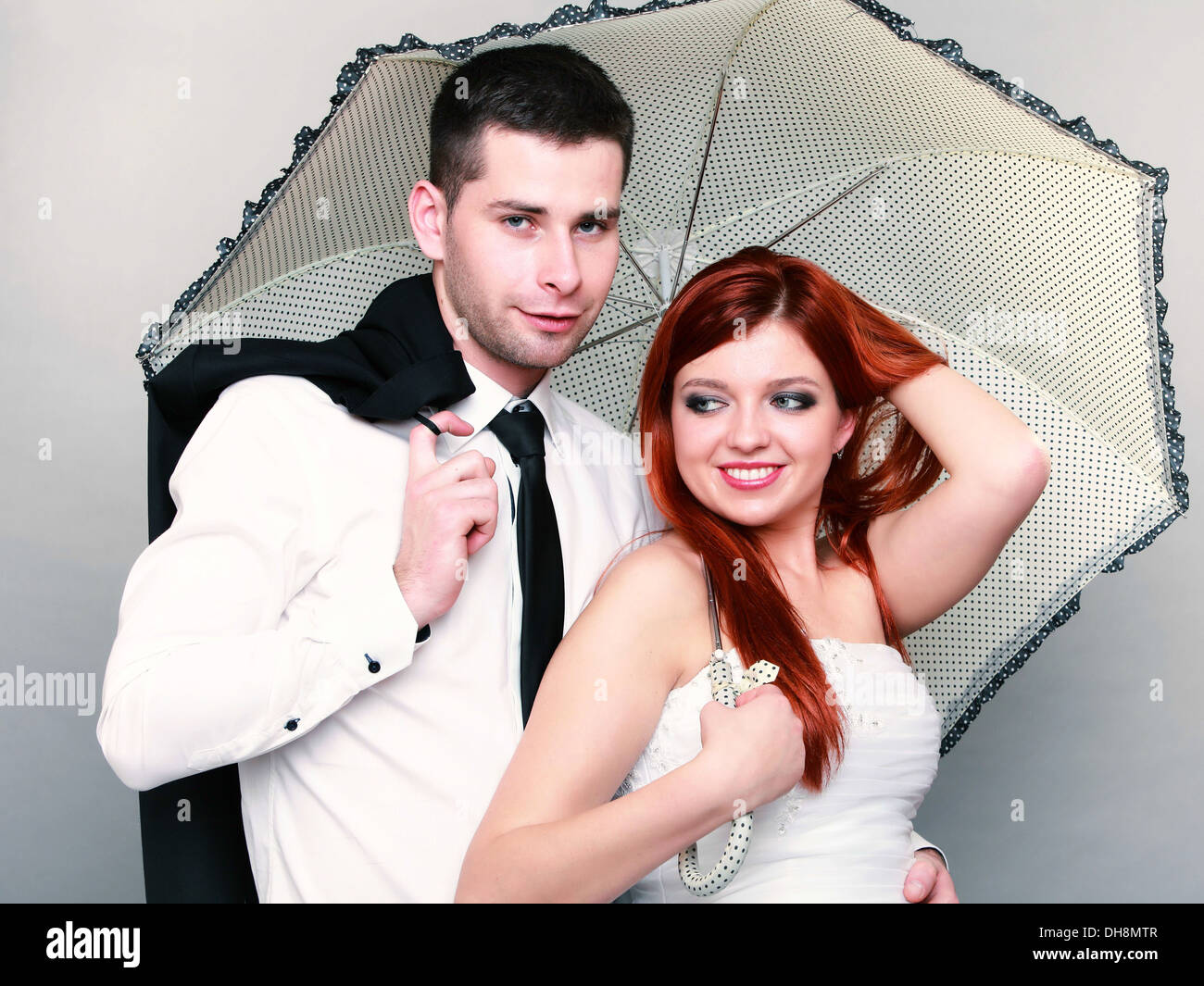 Wedding day. Portrait of happy married couple red haired blue eyed ...