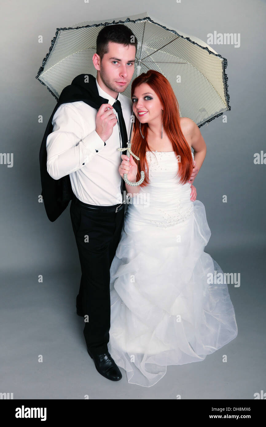 Wedding day. Portrait of happy married couple red haired blue eyed ...