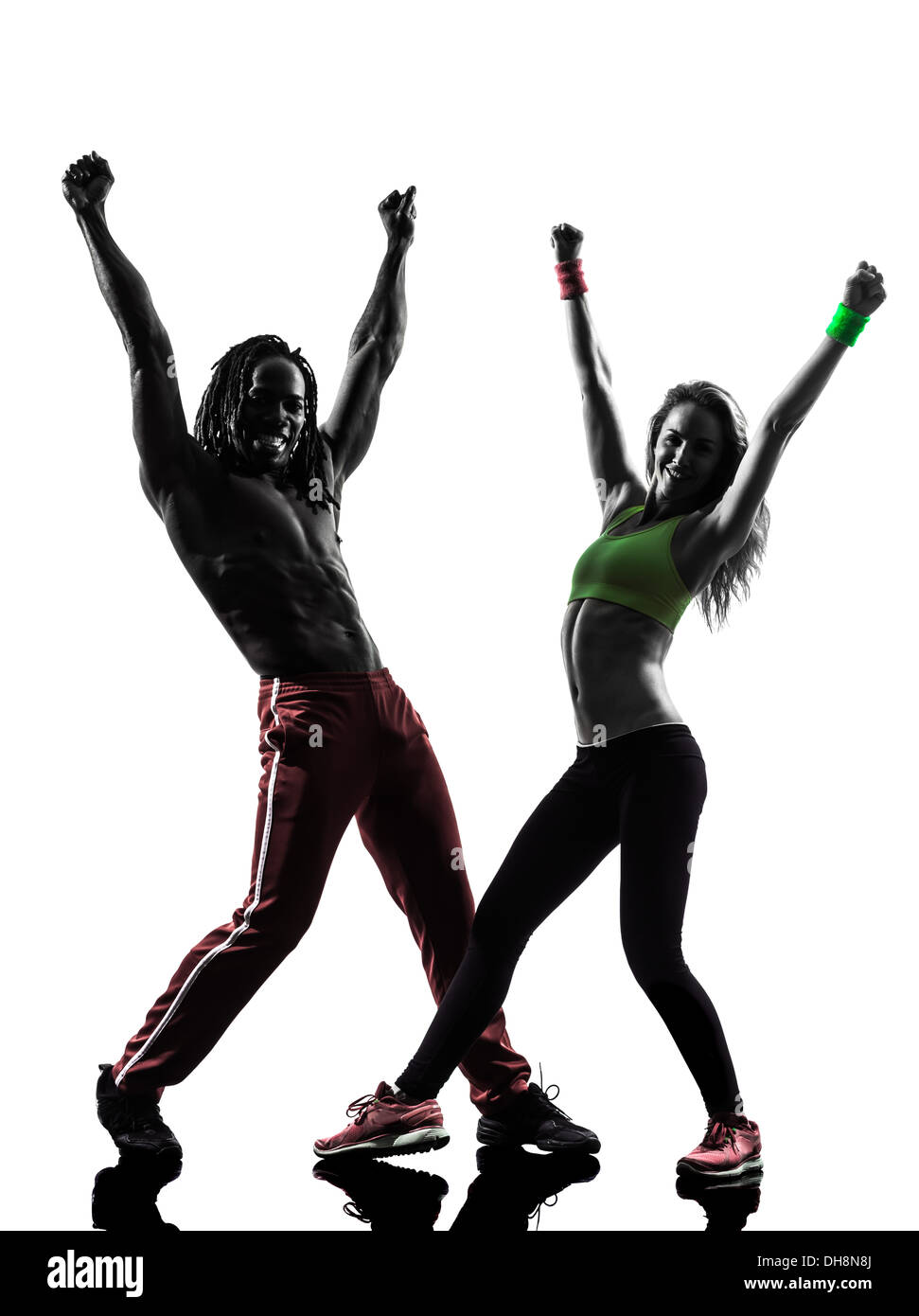 couple man and woman exercising fitness zumba dancing in silhouette on ...
