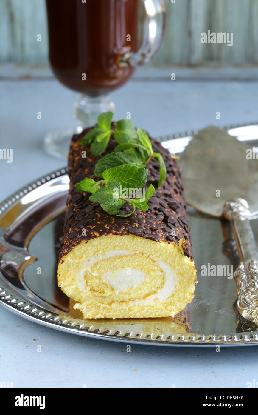 vanilla roll cake with chocolate ganache and creamy cream Stock Photo ...