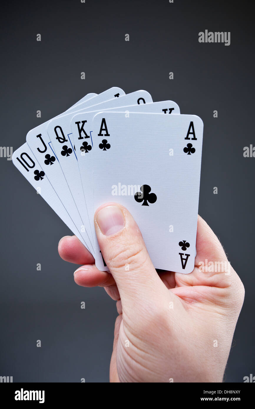 Playing cards being held in mans hand Stock Photo - Alamy