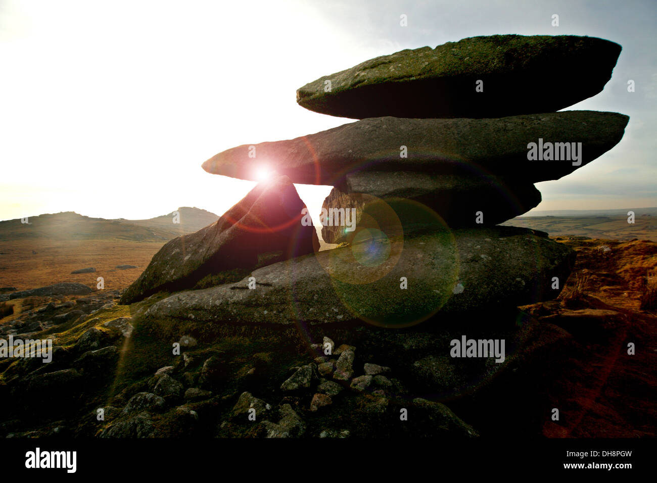 Sunset through rock stack, on Roughtor sadle back mountain Stock Photo ...