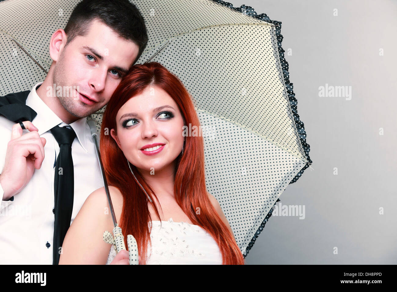 Wedding day. Portrait of happy married couple red haired blue eyed ...