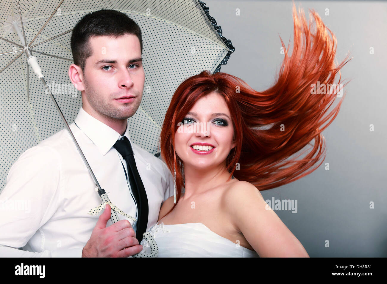 Wedding day. Portrait of happy married couple red haired blue eyed ...
