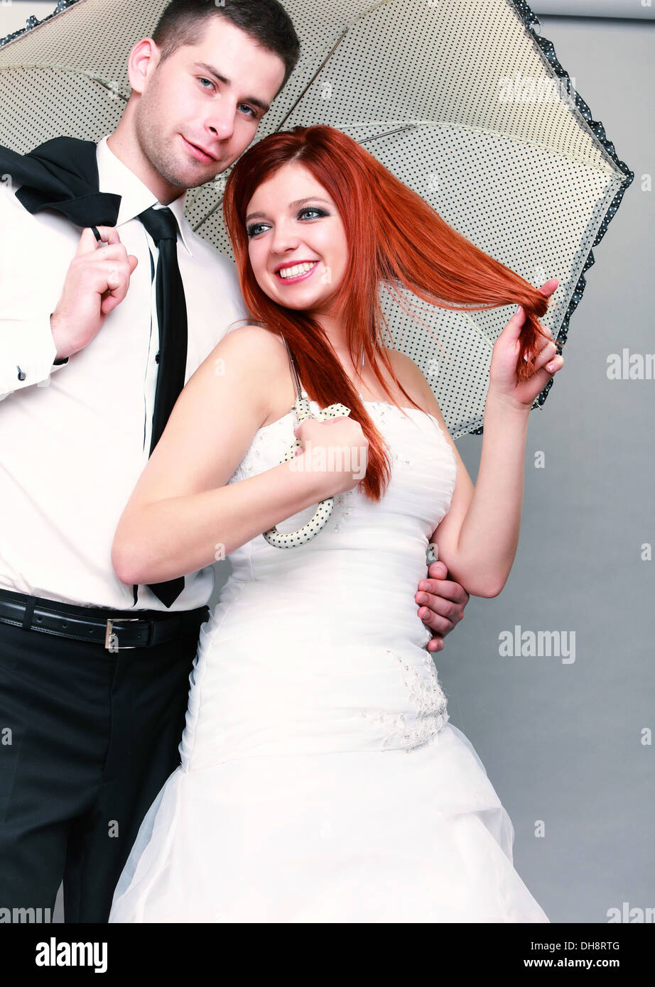 Wedding day. Portrait of happy married couple red haired blue eyed ...