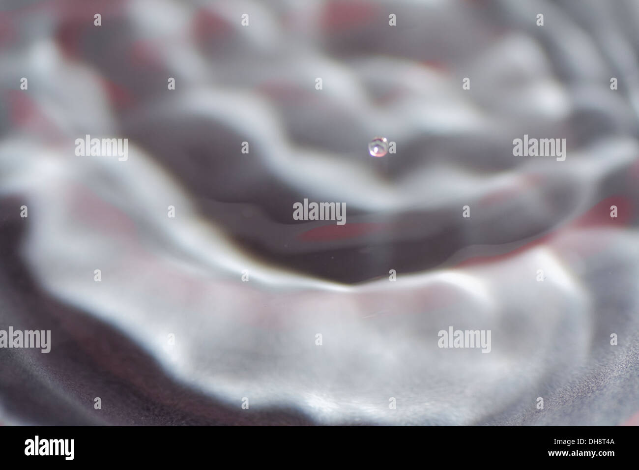 Water drop with colored reflects Stock Photo - Alamy