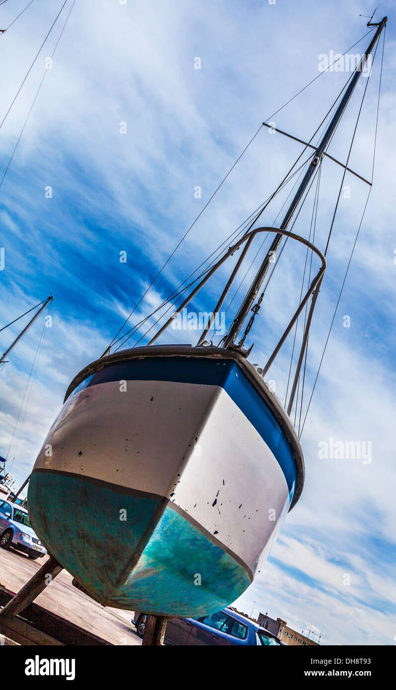 Close-up of the hull of a yacht in dry dock awaiting maintenance and ...