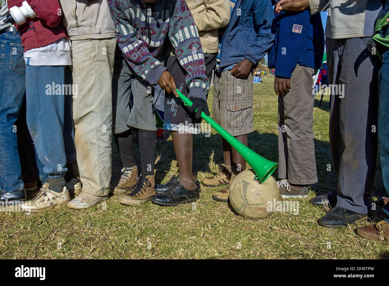 Children queue for food during a mock World Cup soccer tournament ...