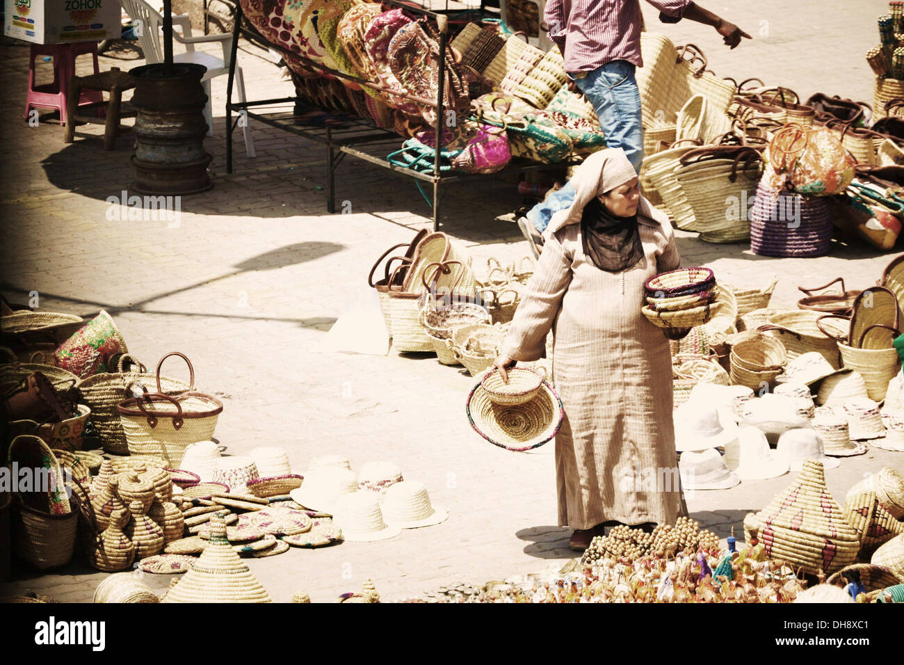 Woman in Marrakech selling baskets Stock Photo - Alamy
