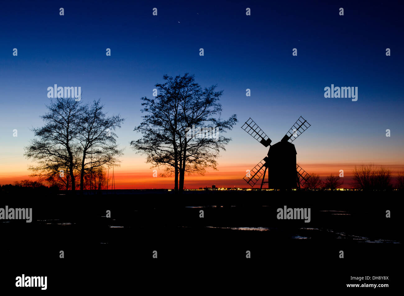 Windmill and trees in sunset Stock Photo - Alamy