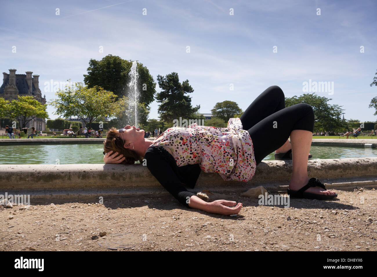 Photographers wife spewing water from fountain Stock Photo - Alamy