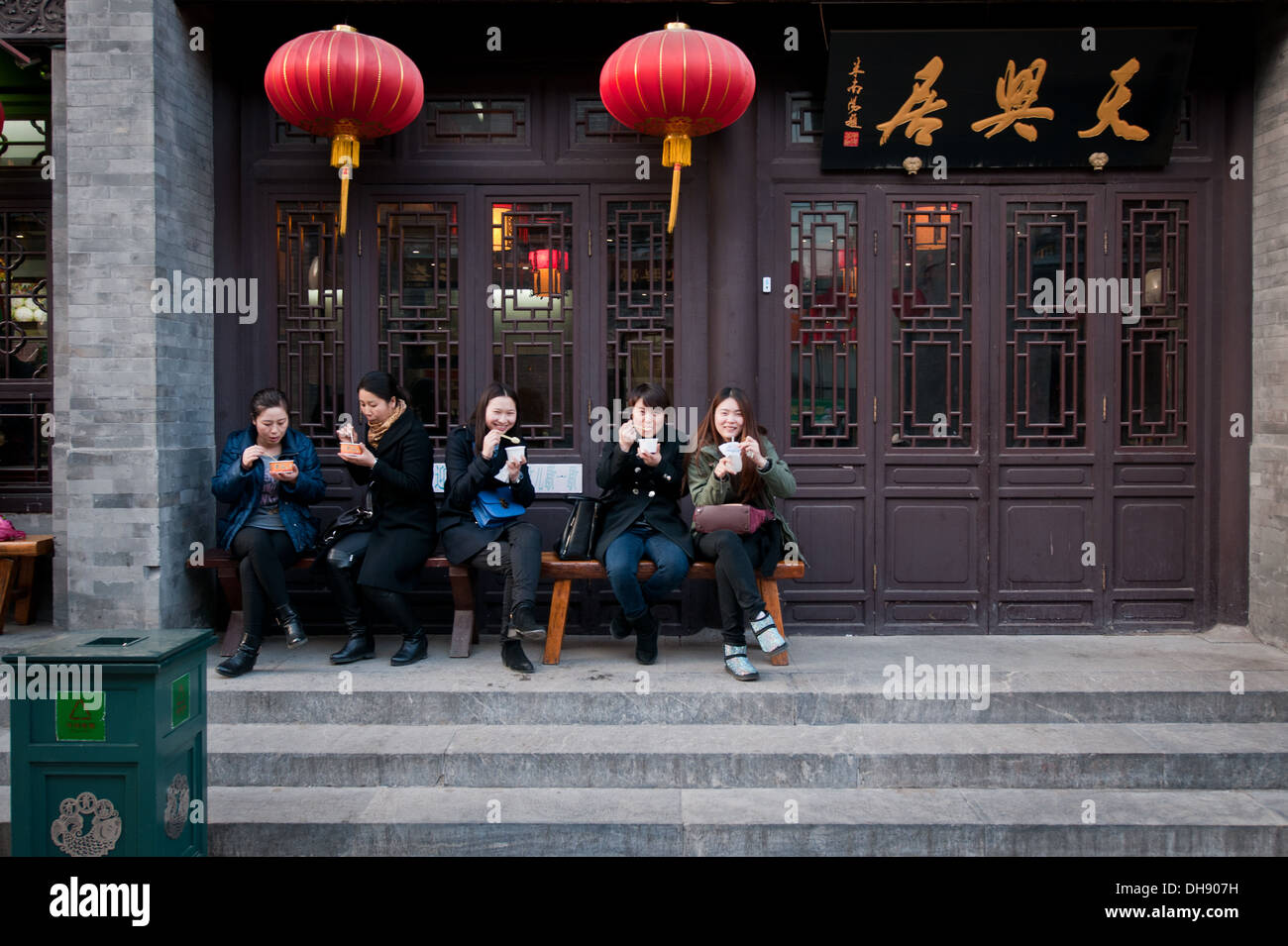 Chinese girls at renovated 570-year-old Xianyukou Street in Beijing ...