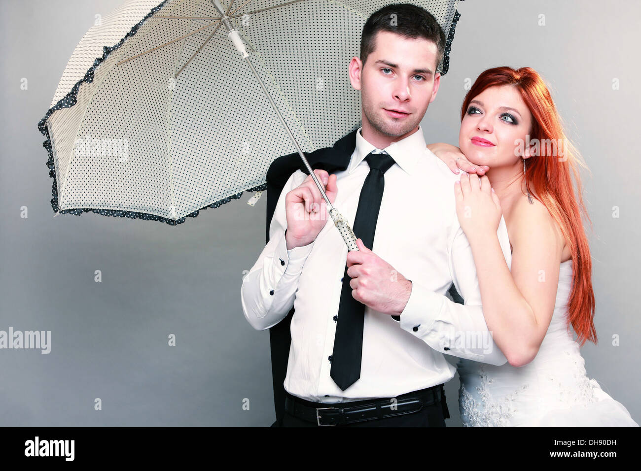 Wedding day. Portrait of happy married couple red haired blue eyed ...