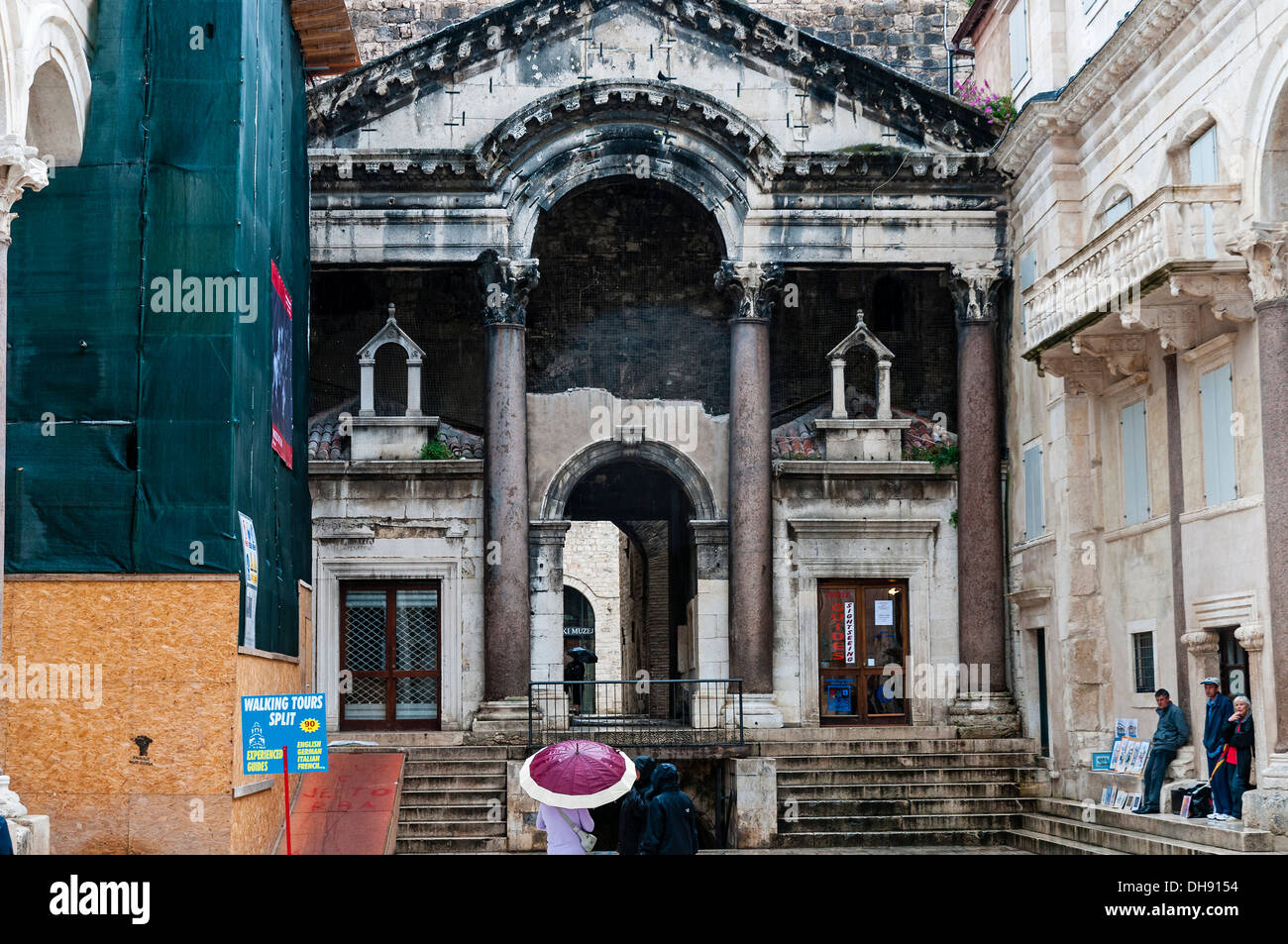 4 marble columns support a triangular gable above a central arch in the ...
