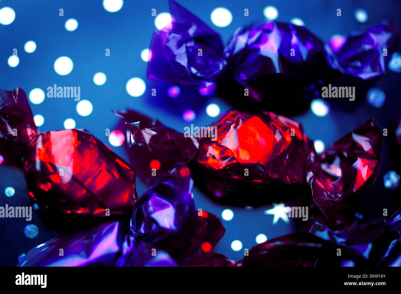 Red and blue wrapped sweets Stock Photo - Alamy