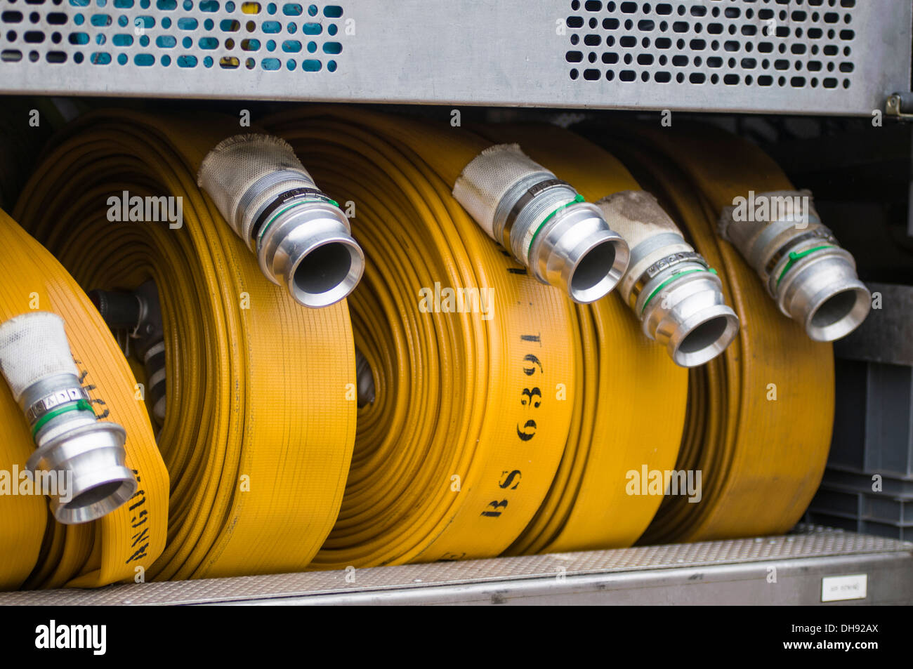 Fire hoses in the back of a fire engine Stock Photo - Alamy