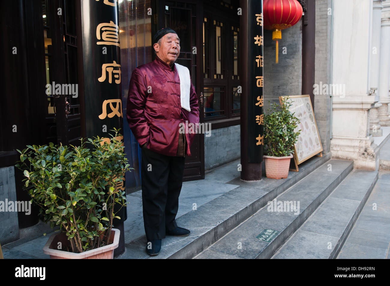 Man standing in front of restaurant at renovated 570-year-old Xianyukou ...