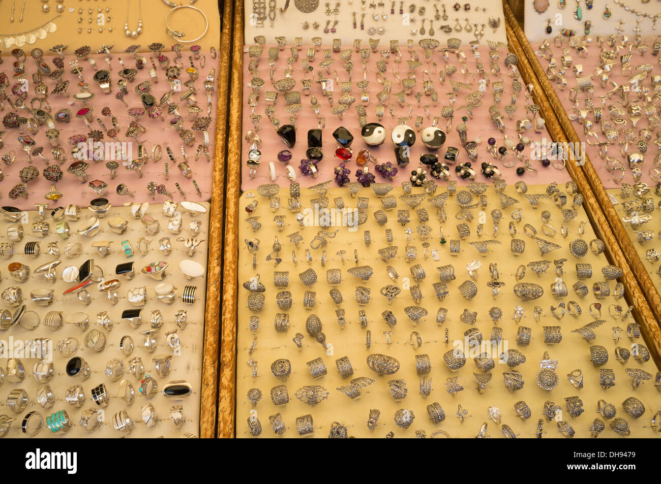 Silver trinkets displayed on a market stall Stock Photo - Alamy