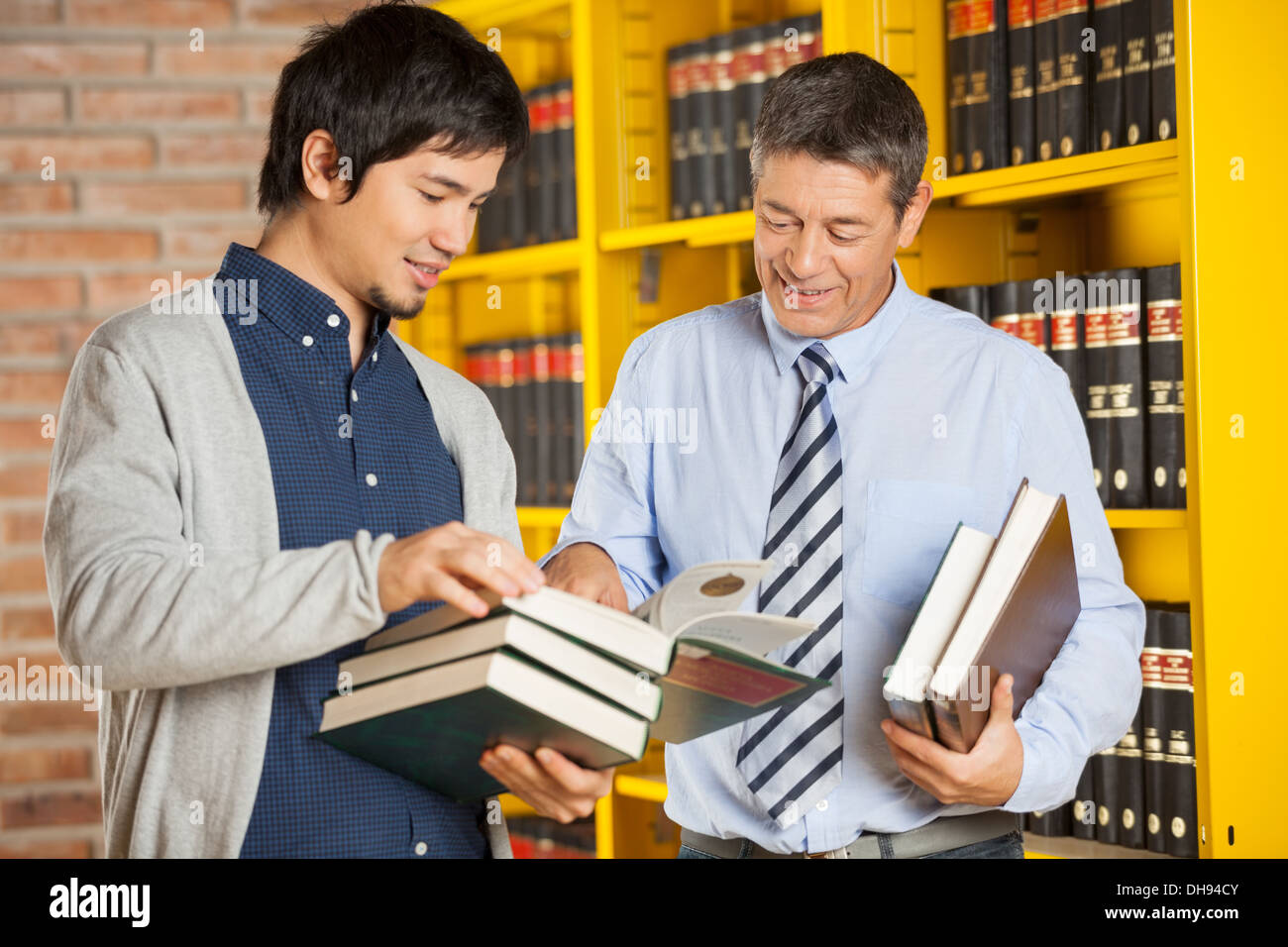 Asian holding library books hi-res stock photography and images - Alamy
