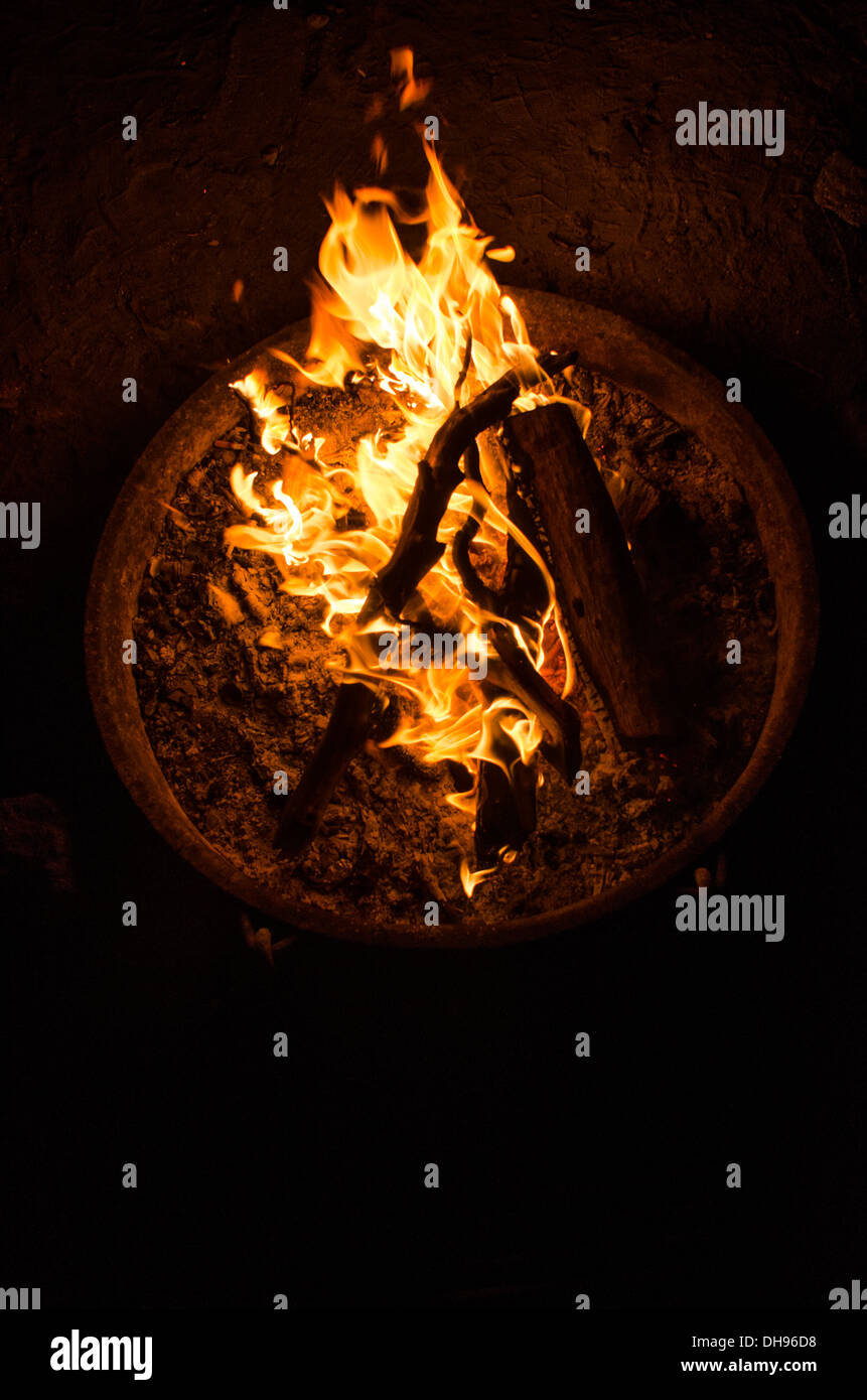 An overhead photograph of a fire pit with burning fire wood Stock Photo ...