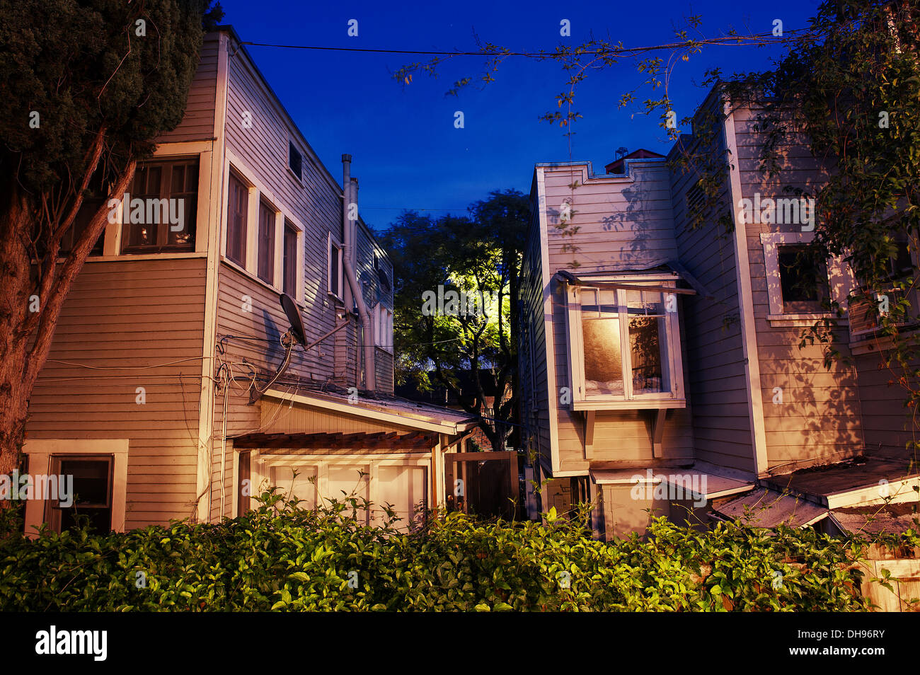 houses in twilight lit by the street lights Stock Photo - Alamy