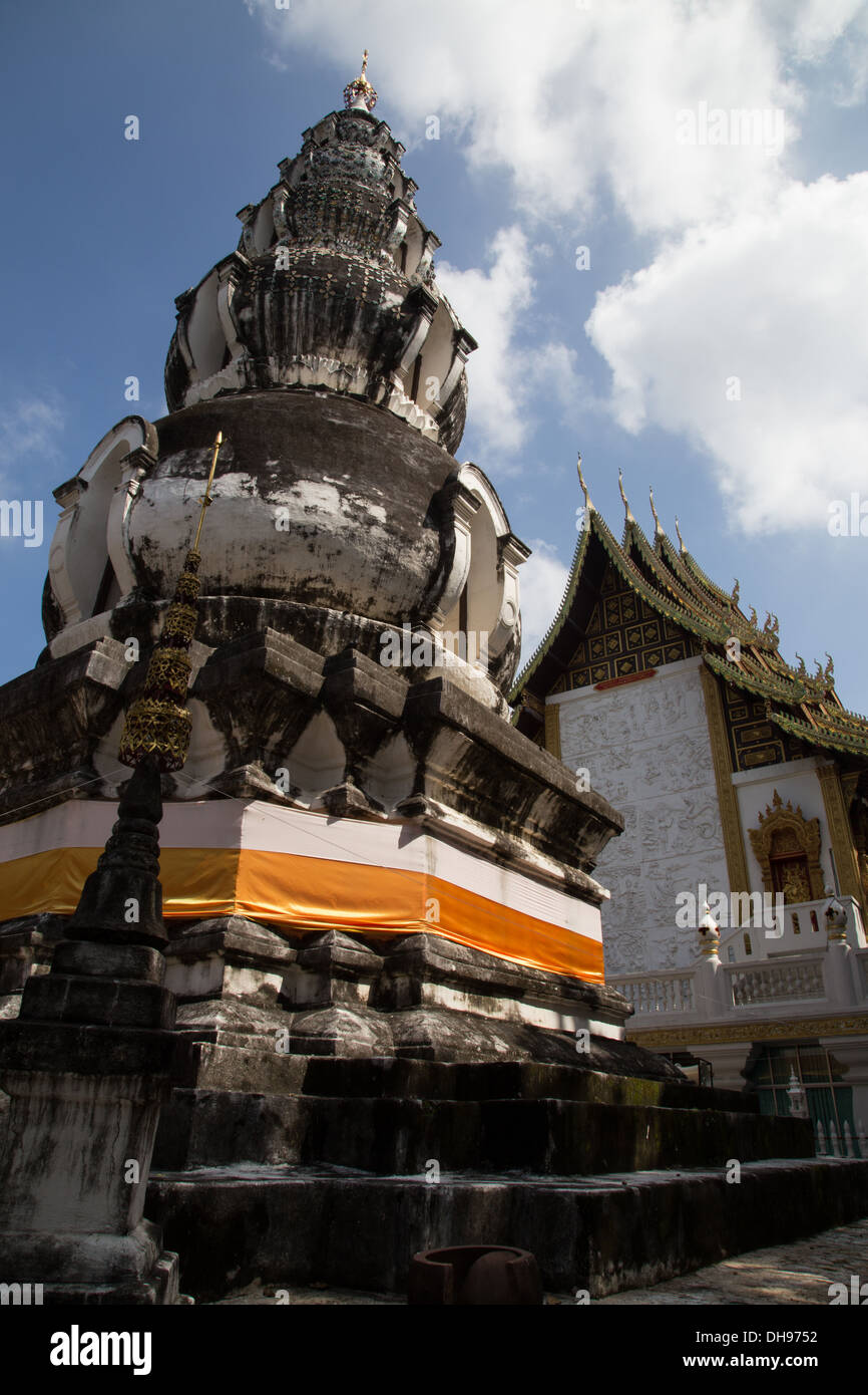 Wat Ku Tao is decorated with colourful porcelain tiles and represents ...