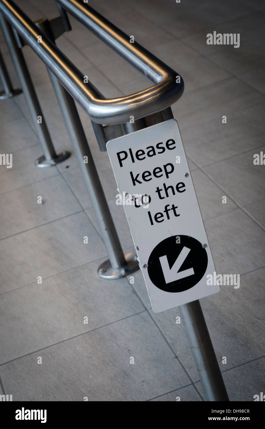 Keep to the Left sign in railway station Stock Photo - Alamy