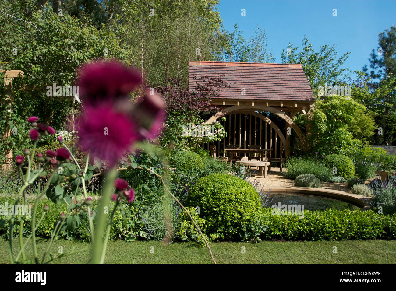 Pretty garden shelter on display with water feature at Chelsea flower ...