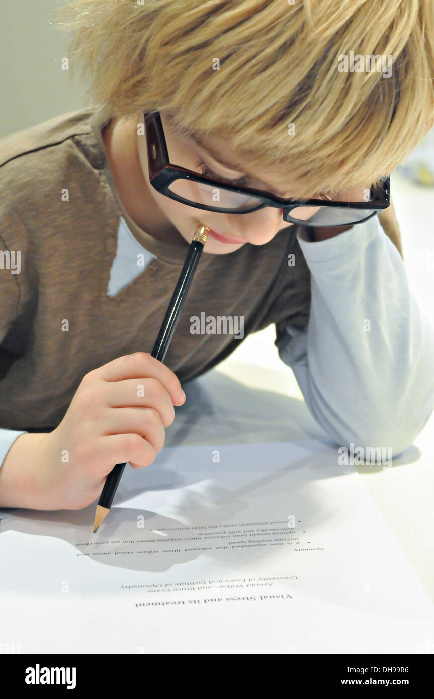 A keen child works on his homework Stock Photo - Alamy