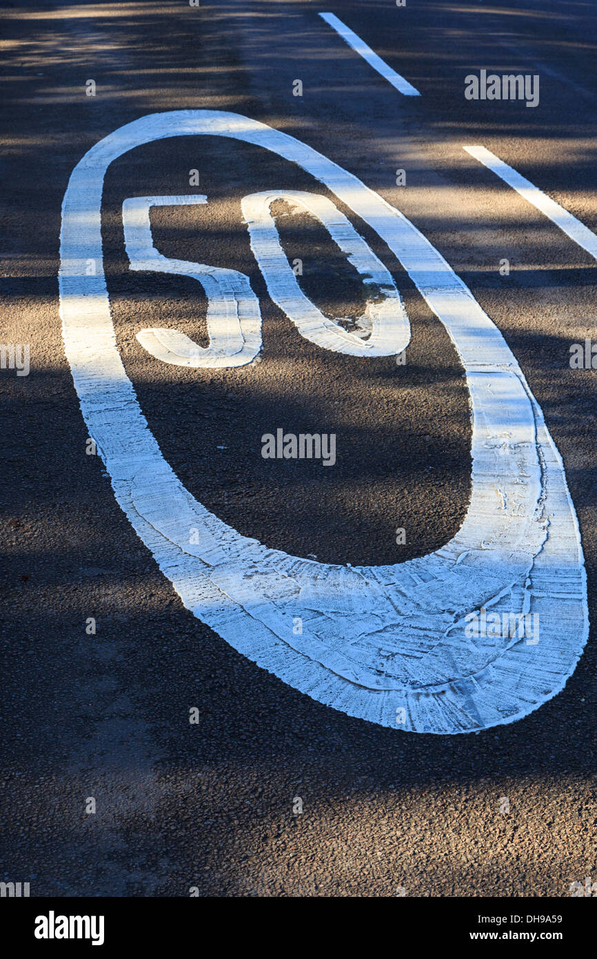 fifty miles per house speed limit road marking england Stock Photo - Alamy