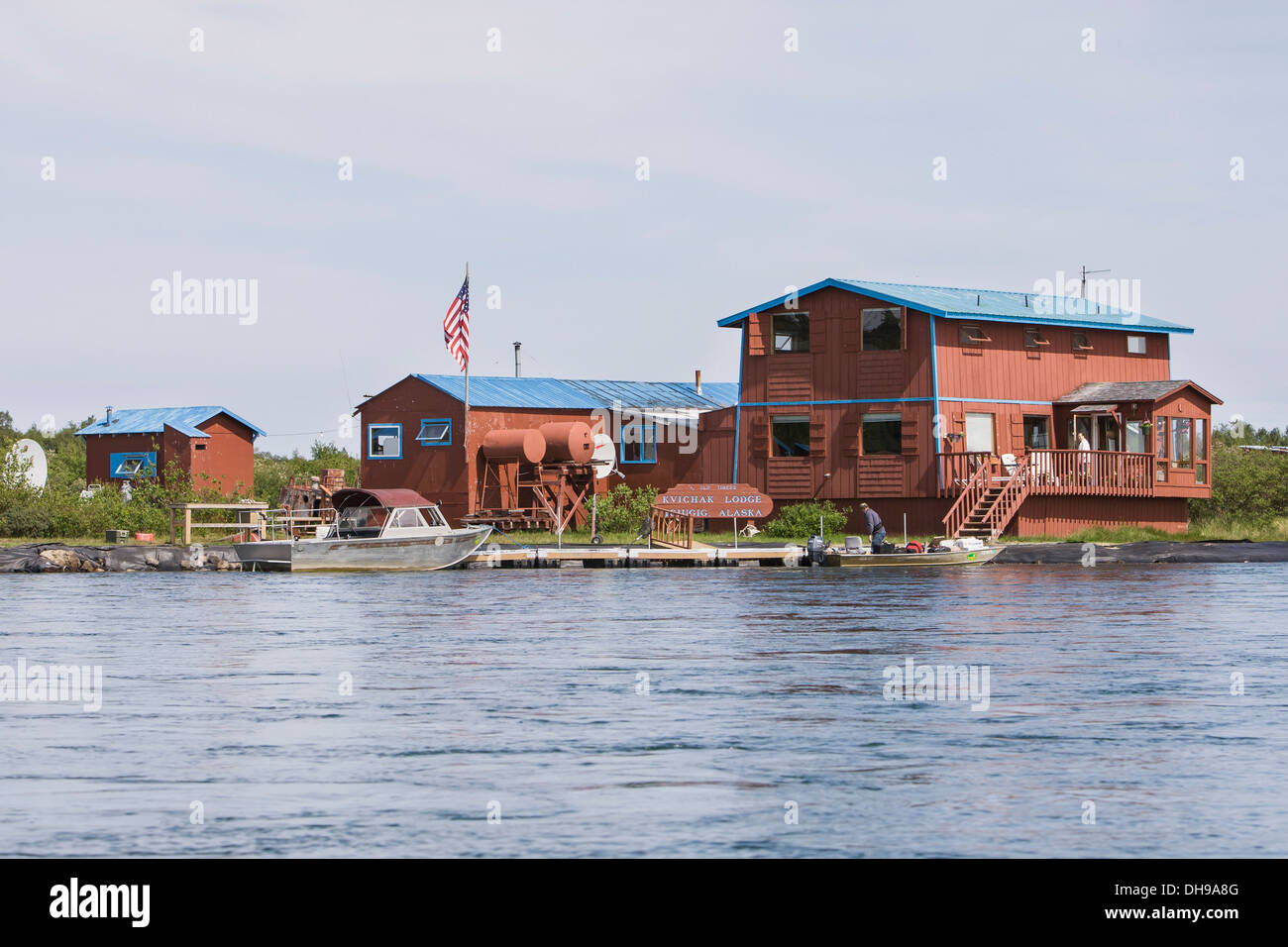 A View Of The Kvichak Lodge From The Water With Riverboats Docked On ...
