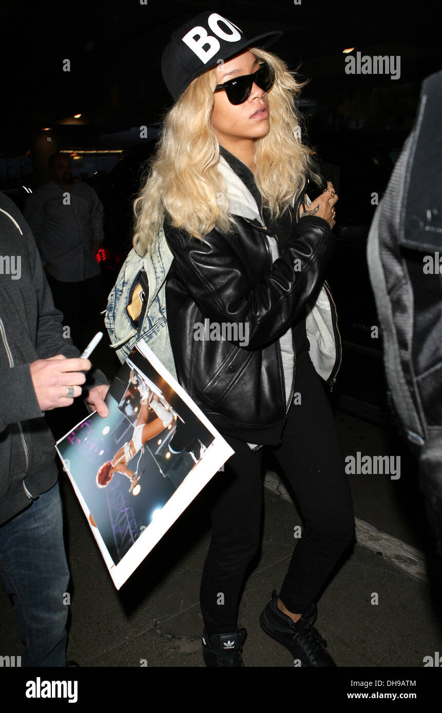 Rihanna arrives at LAX wearing a 'BOY London' cap singer was boarding a ...