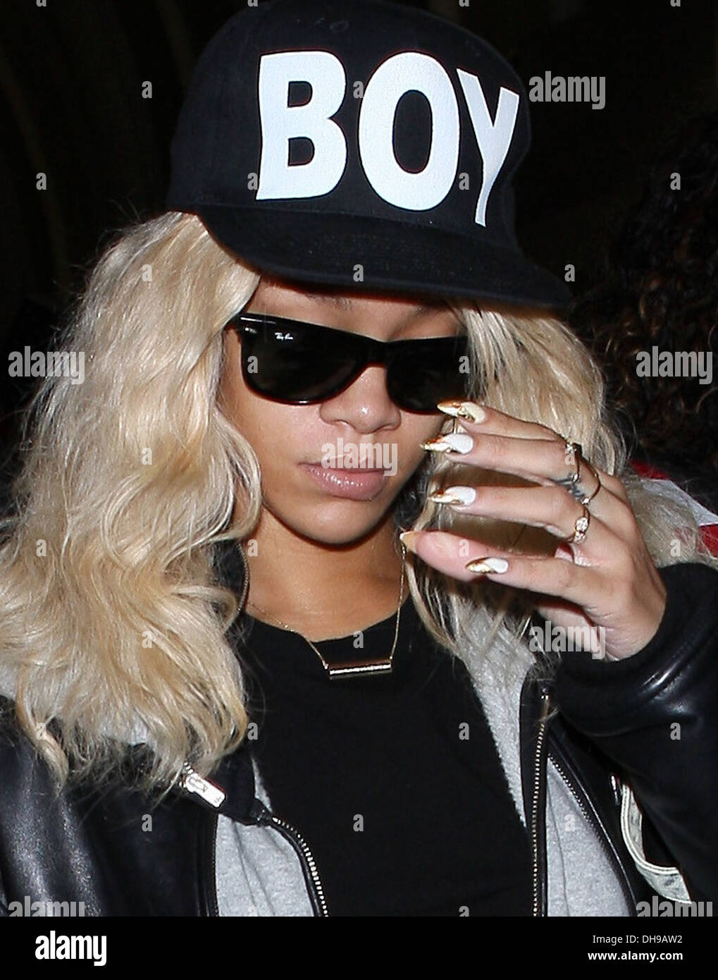 Rihanna arrives at LAX wearing a 'BOY London' cap singer was boarding a ...