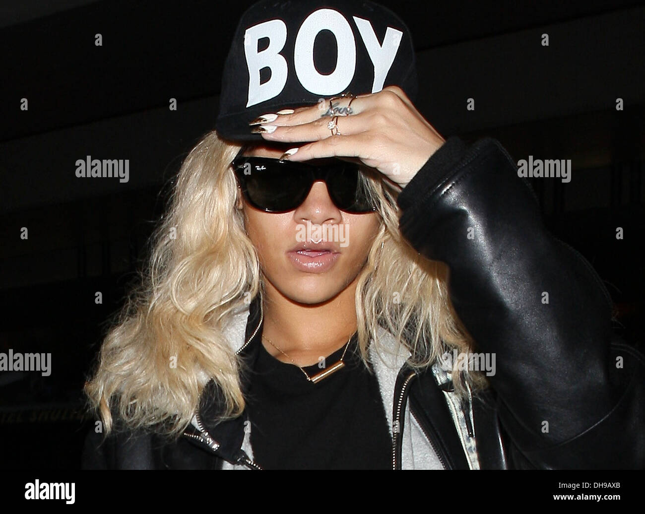 Rihanna arrives at LAX wearing a 'BOY London' cap singer was boarding a ...