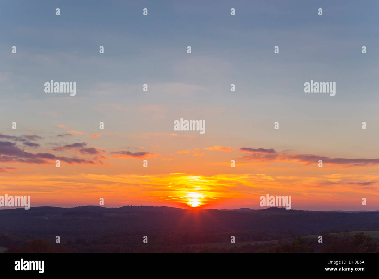 SUNSET OVER LAND Stock Photo - Alamy