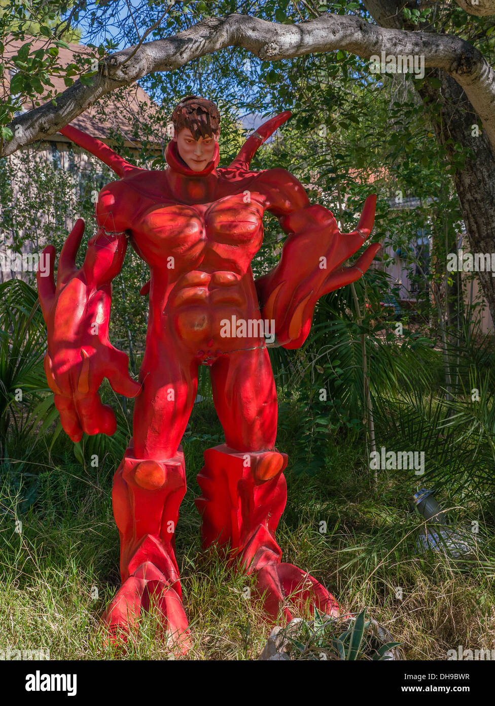 Grotesque huge red super-hero figure in the front of a house in Ojai ...