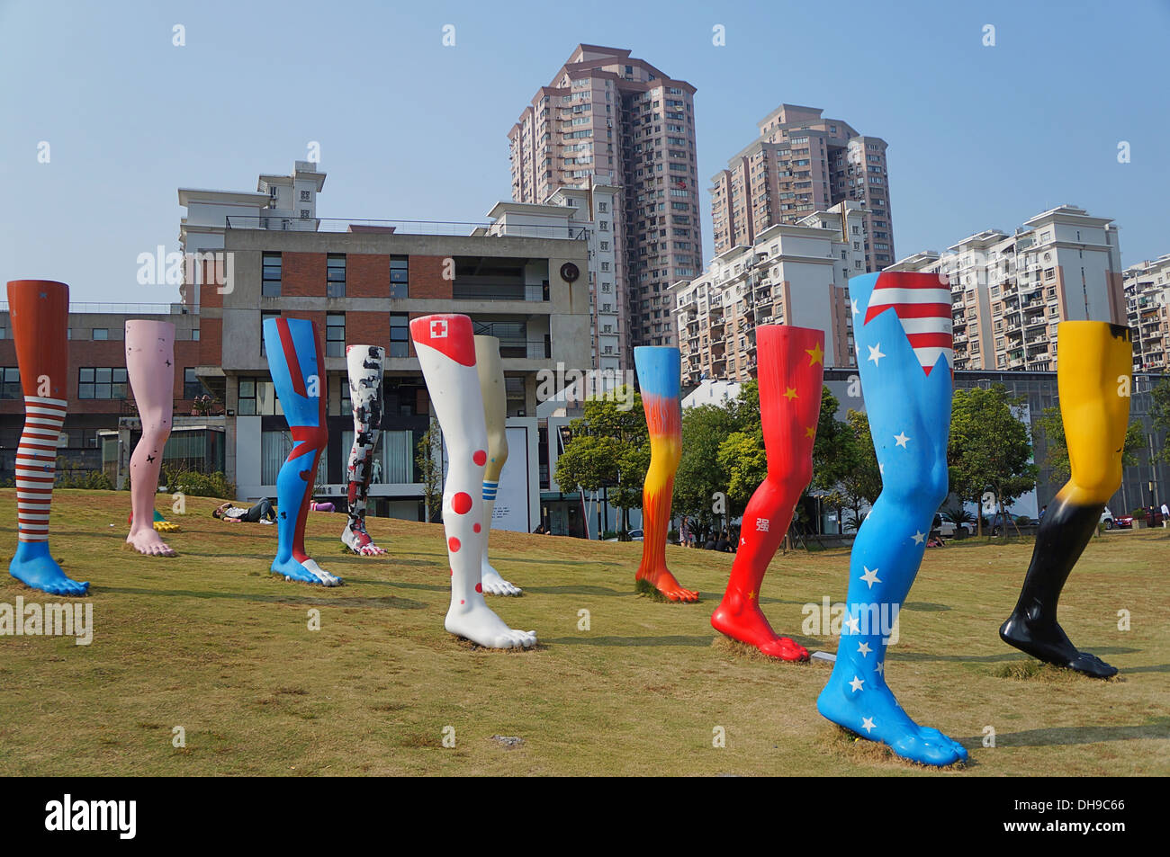 Art installation of legs decorated with world flags Stock Photo - Alamy