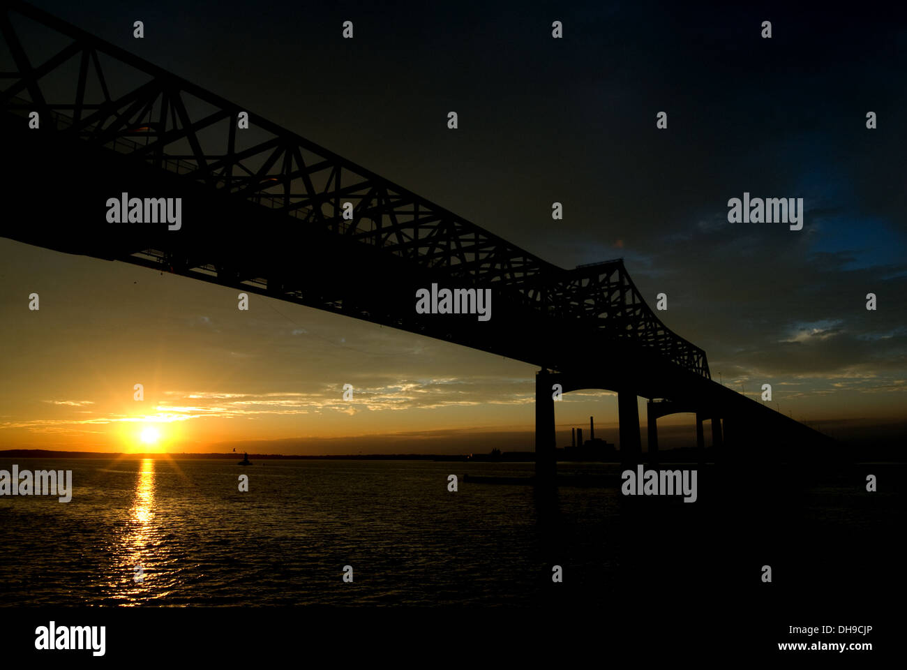 Sunset behind the Charles Braga Bridge over the Taunton River between ...