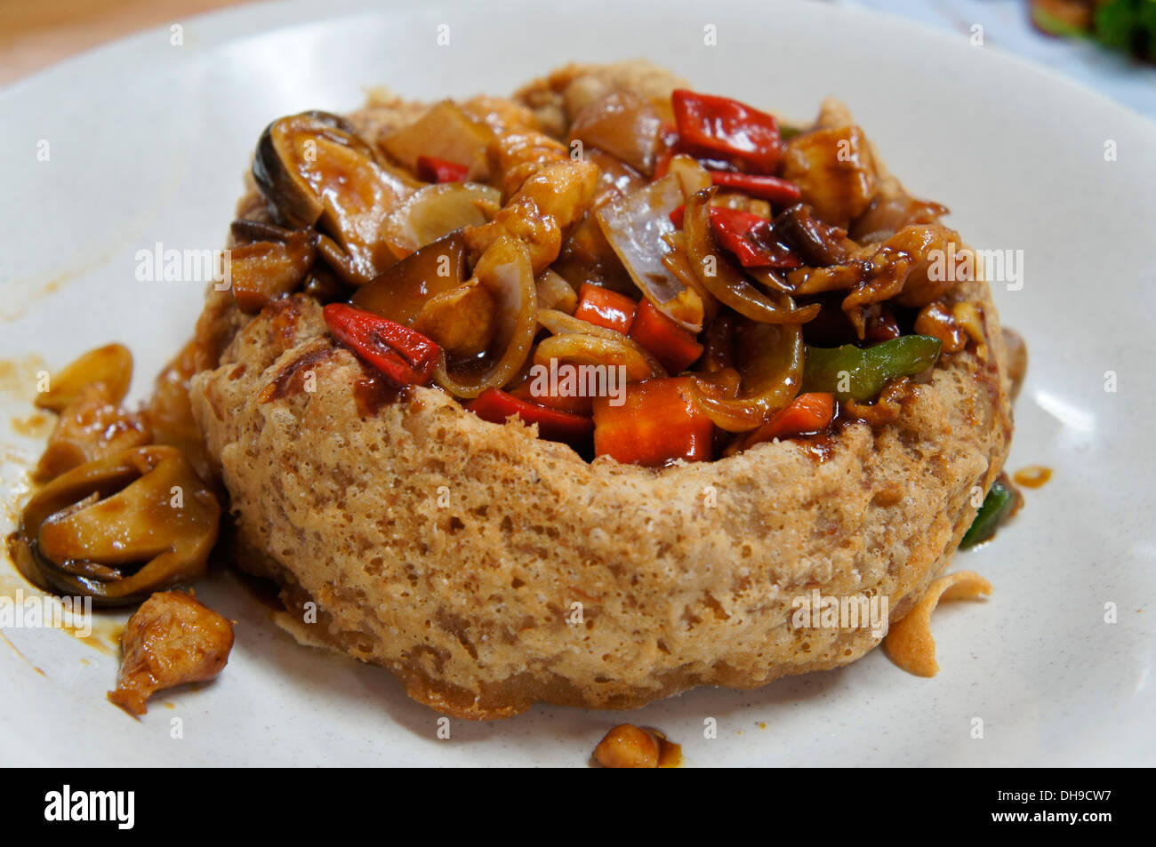 yam basket with kung pao chicken, popular Chinese dish Stock Photo - Alamy